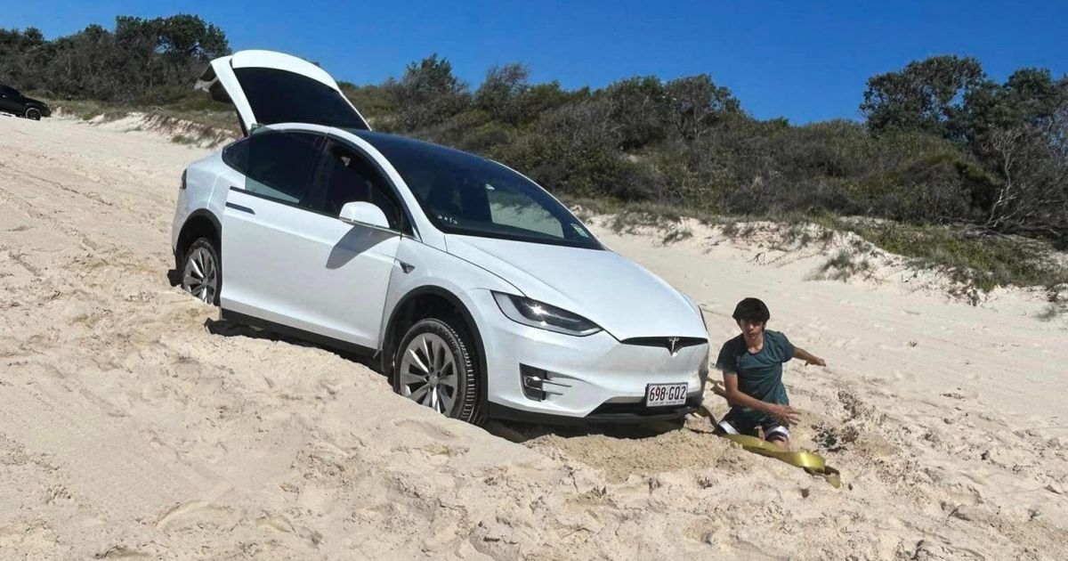 Rented Tesla Model X gets stuck on beach, front then ripped off car ...