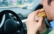 Is it legal to eat while driving in Australia? | CarExpert