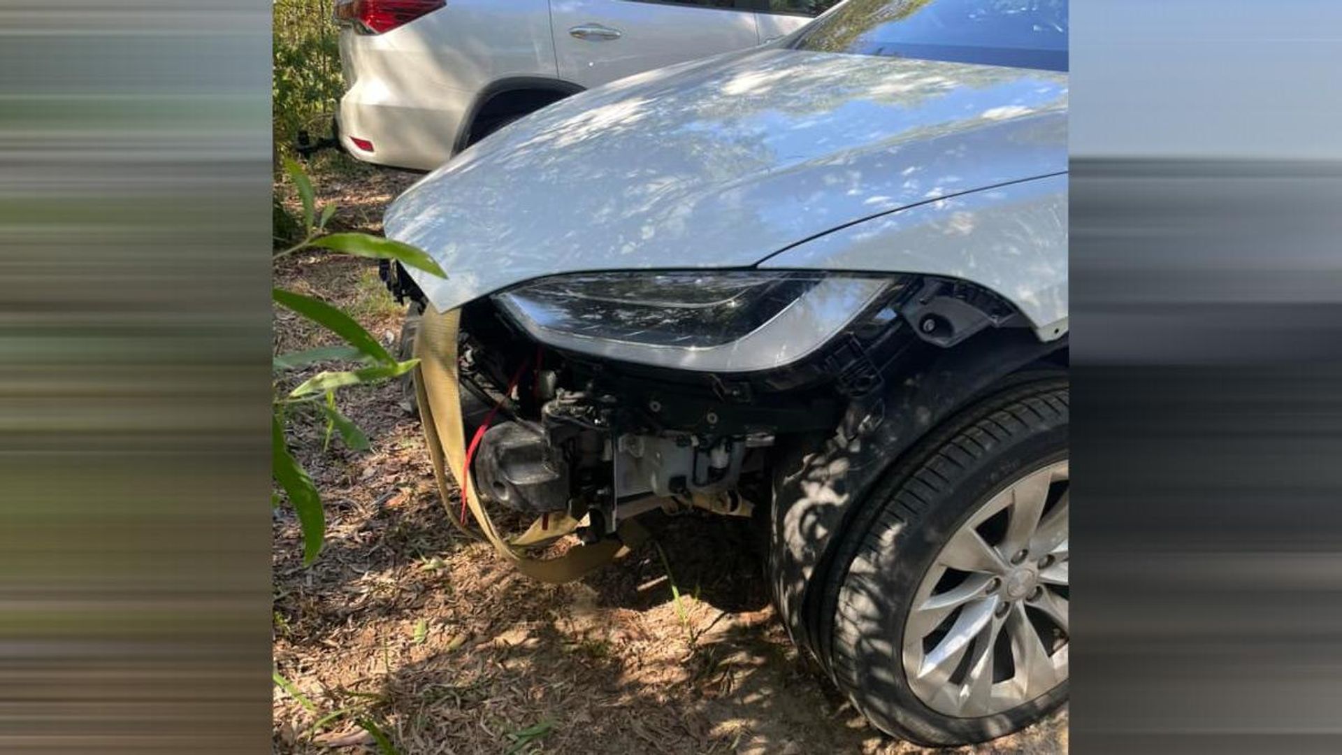 Rented Tesla Model X gets stuck on beach, front then ripped off car ...