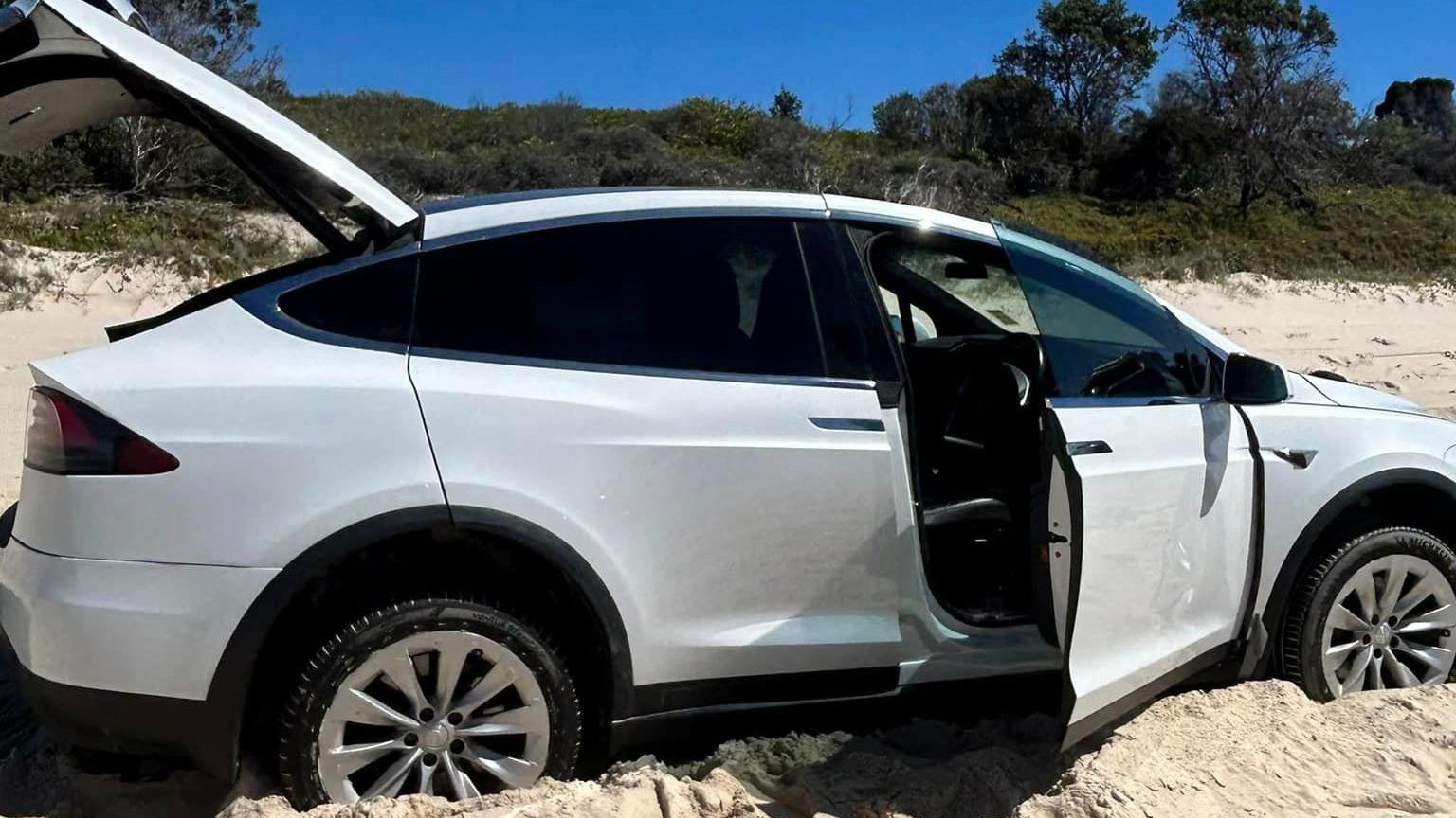 Rented Tesla Model X gets stuck on beach, front then ripped off car ...
