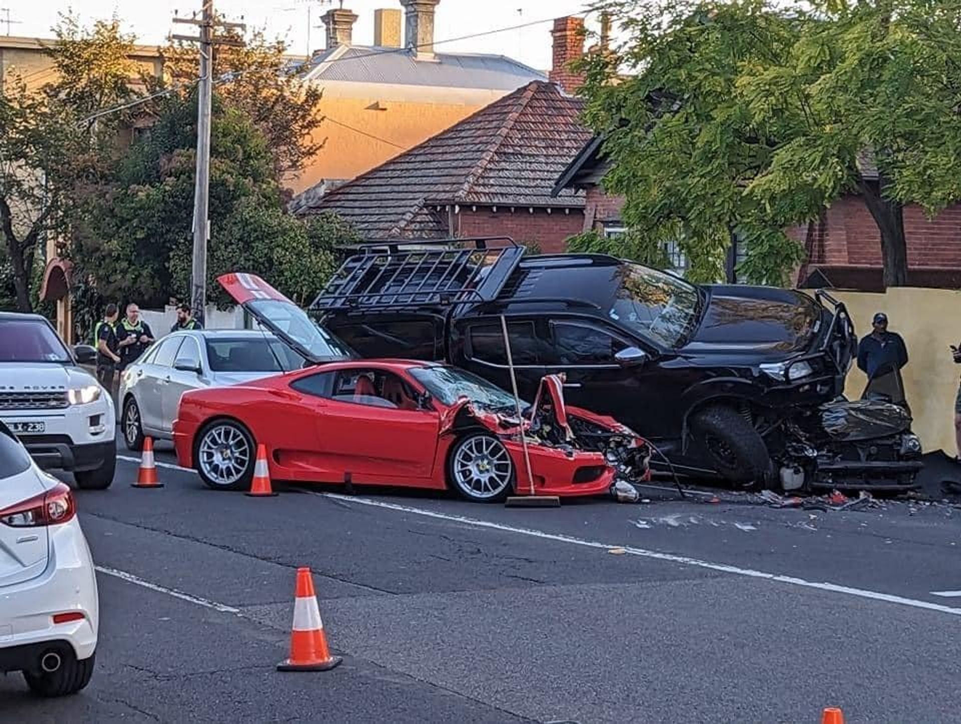Rare Ferrari crashes into and upends pickup truck on Melbourne street ...